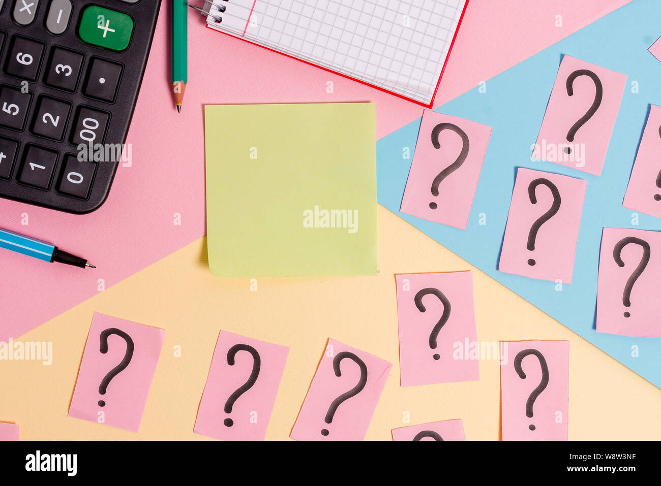 Mathematics stuff and writing equipment above pastel colours background ...