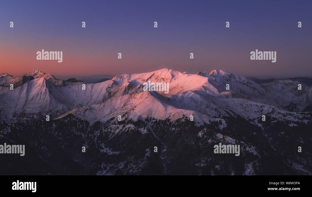 Alpine sunrise on the snowy Agrafa mountains Stock Photo - Alamy