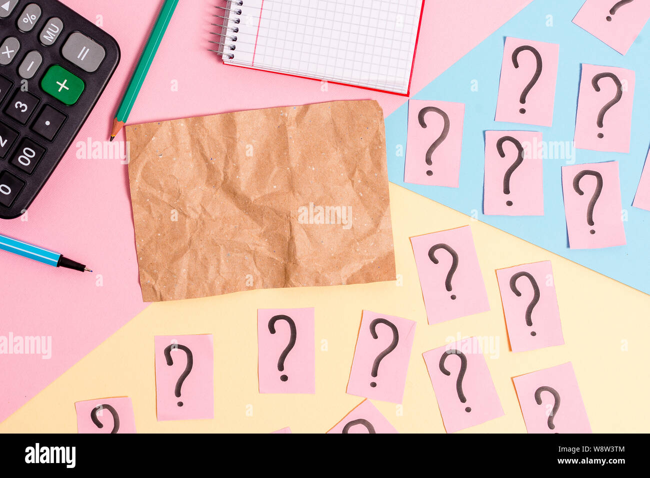 Mathematics stuff and writing equipment above pastel colours background ...