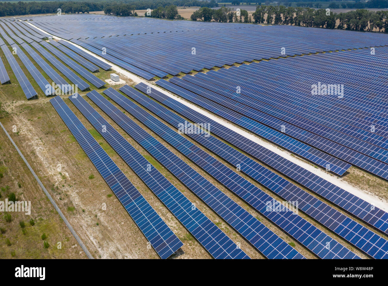 Aerial View Of Large Solar Panel Farm In Northern Florida Providing aerial-view-of-large-solar-panel-farm-in-northern-florida-providing