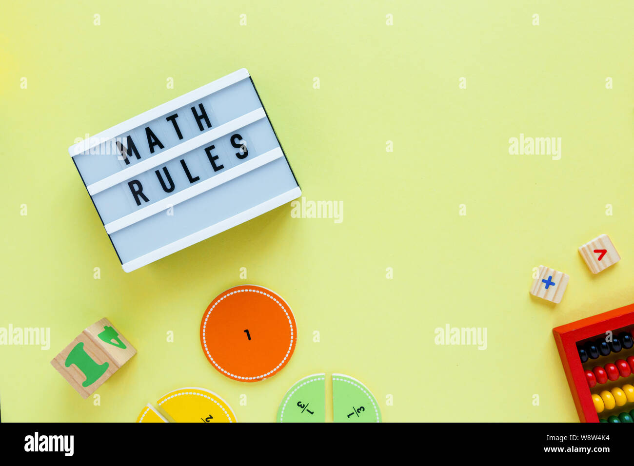 Creative Сolorful blocks, light box, fractions on yellow background ...