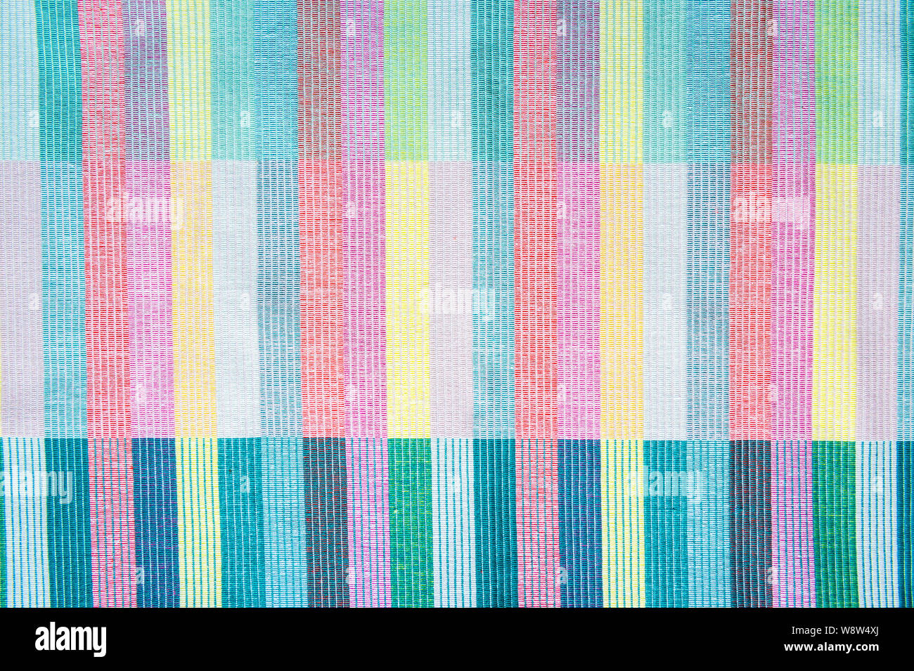 Colorful textile abstract background in a full frame close-up of woven ...