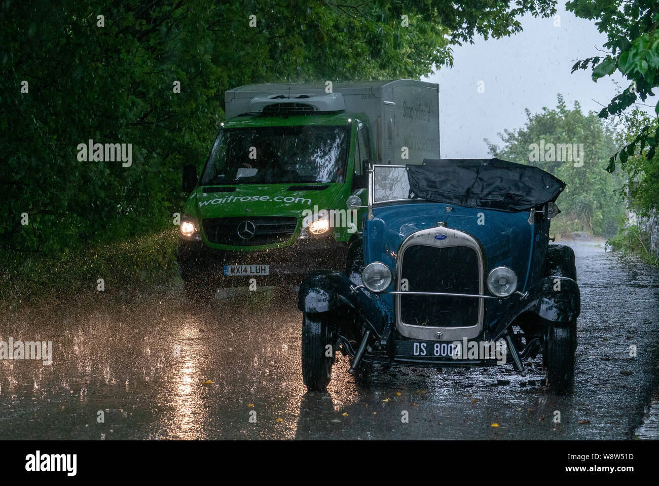 1929 Ford Roadster driver caught in heavy rain, Frome Somerset UK Stock ...