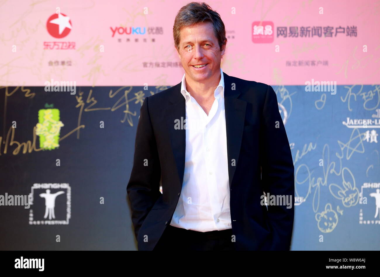English actor Hugh Grant poses on the red carpet for the opening ...