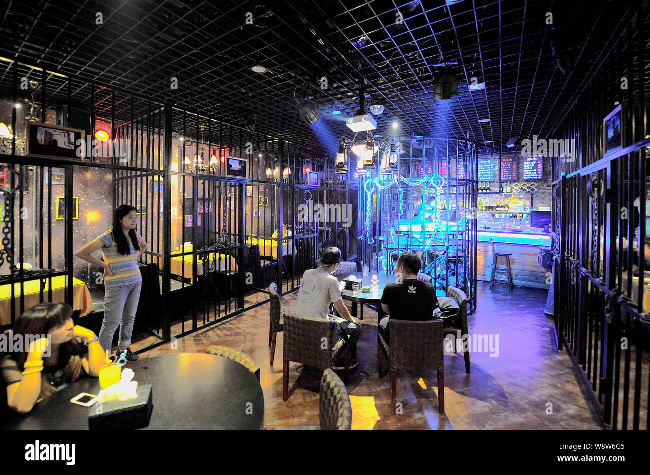 Customers dine at the first prison-themed restaurant in Tianjin, China ...