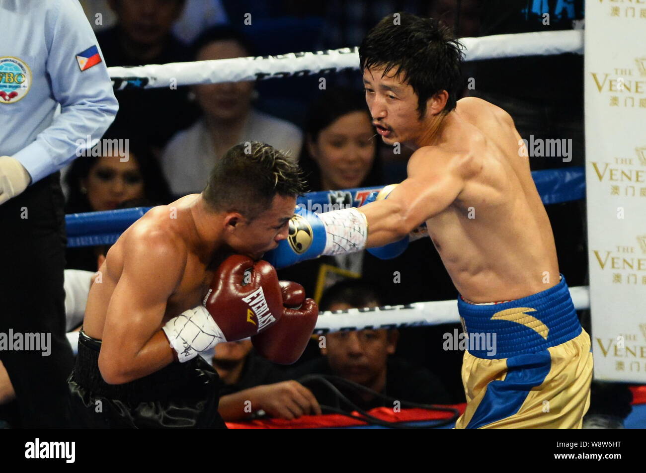 Zou Shiming of China, right, hits Luis De La Rosa of Colombia in their ...