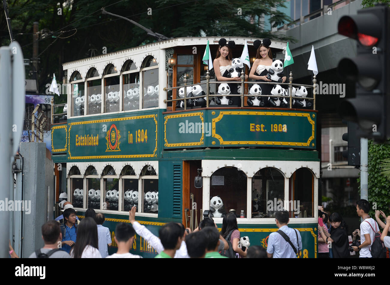 A double-decker tram with the paper pandas created by French artist ...