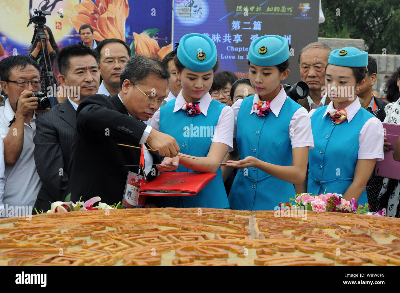 An officer of the World Record Association checks the world's largest ...