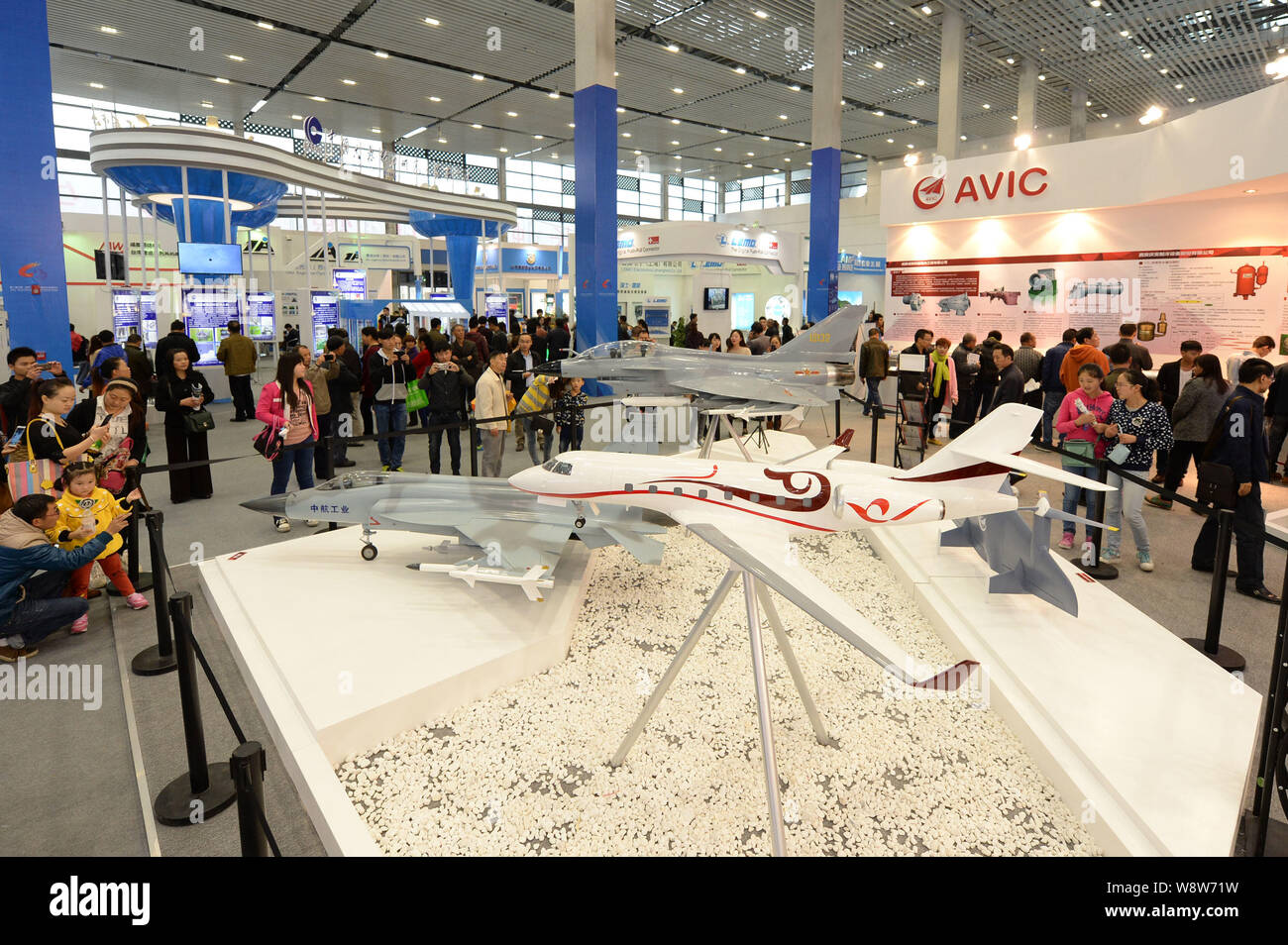 Visitors view model aircraft on display at the stand of AVIC (Aviation ...