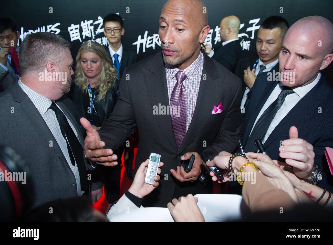 American actor Dwayne Johnson, center, is interviewed during a premiere ...