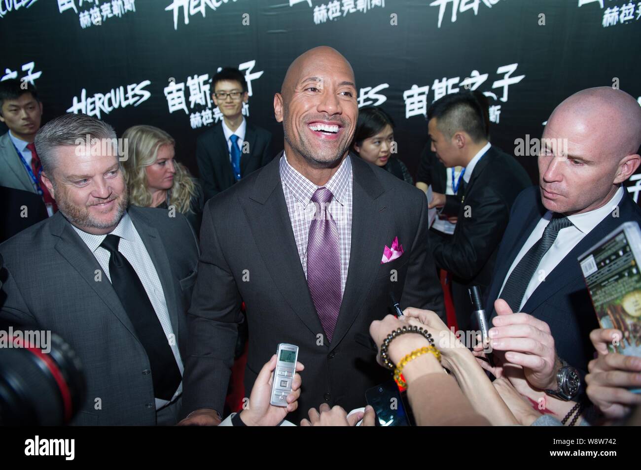 American actor Dwayne Johnson, center, is interviewed during a premiere ...