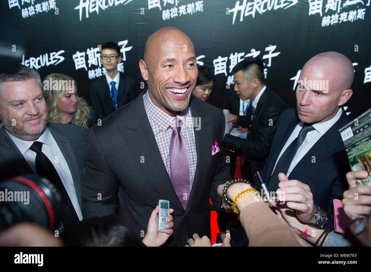 American actor Dwayne Johnson, center, is interviewed during a premiere ...