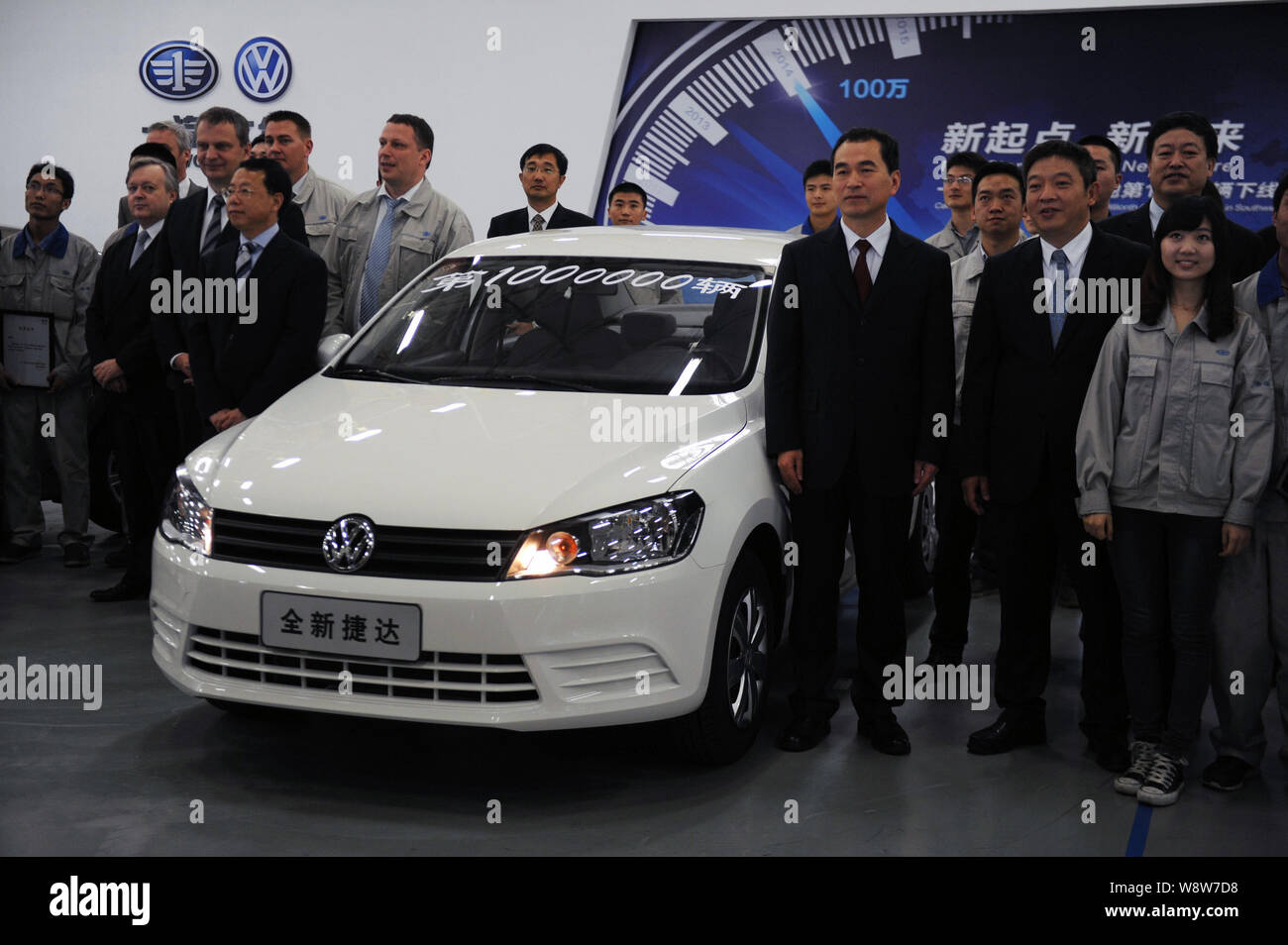 Zhang Pijie, front third right, General Manager of FAW-Volkswagen, and ...