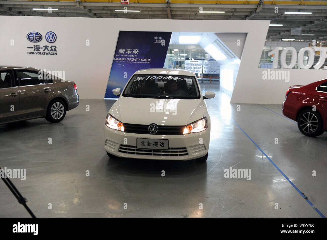 An All-new Jetta, center, the one millionth vehicle produced in FAW ...