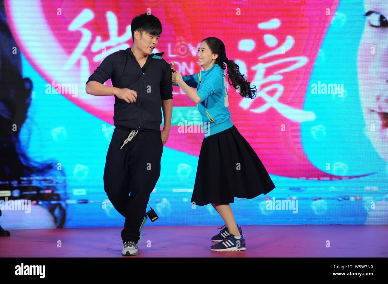Hong Kong actress Angelababy, right, and Chinese actor Chen He play a game during a press ...