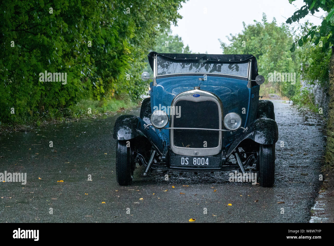 1929 Ford Roadster driver caught in heavy rain, Frome Somerset UK Stock ...