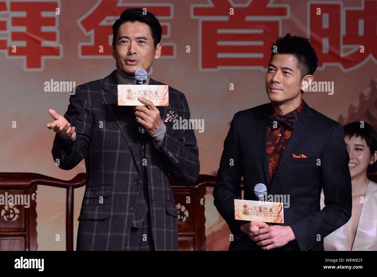 Hong Kong actor Chow Yun-fat, left, speaks as Aaron Kwok, right ...