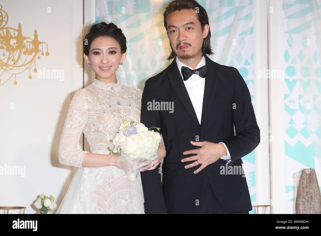 Malaysian Singer Penny Tai Left Poses With Her Taiwanese Husband Sidney Lu Ahead Of Their