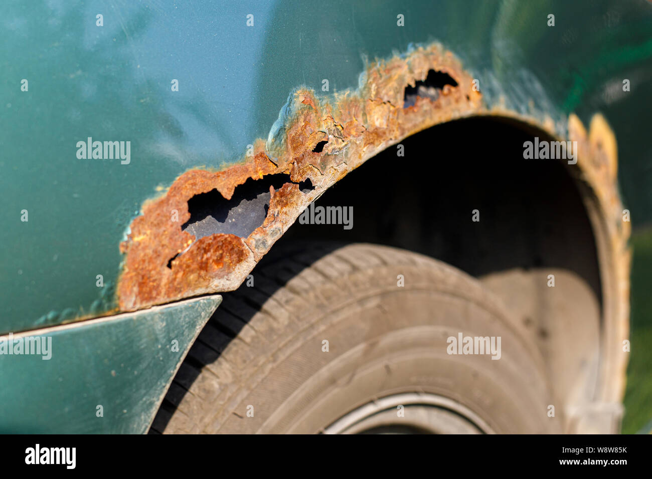 Rusty right wing of car with corrosive defect. Corrosion and rust Stock ...