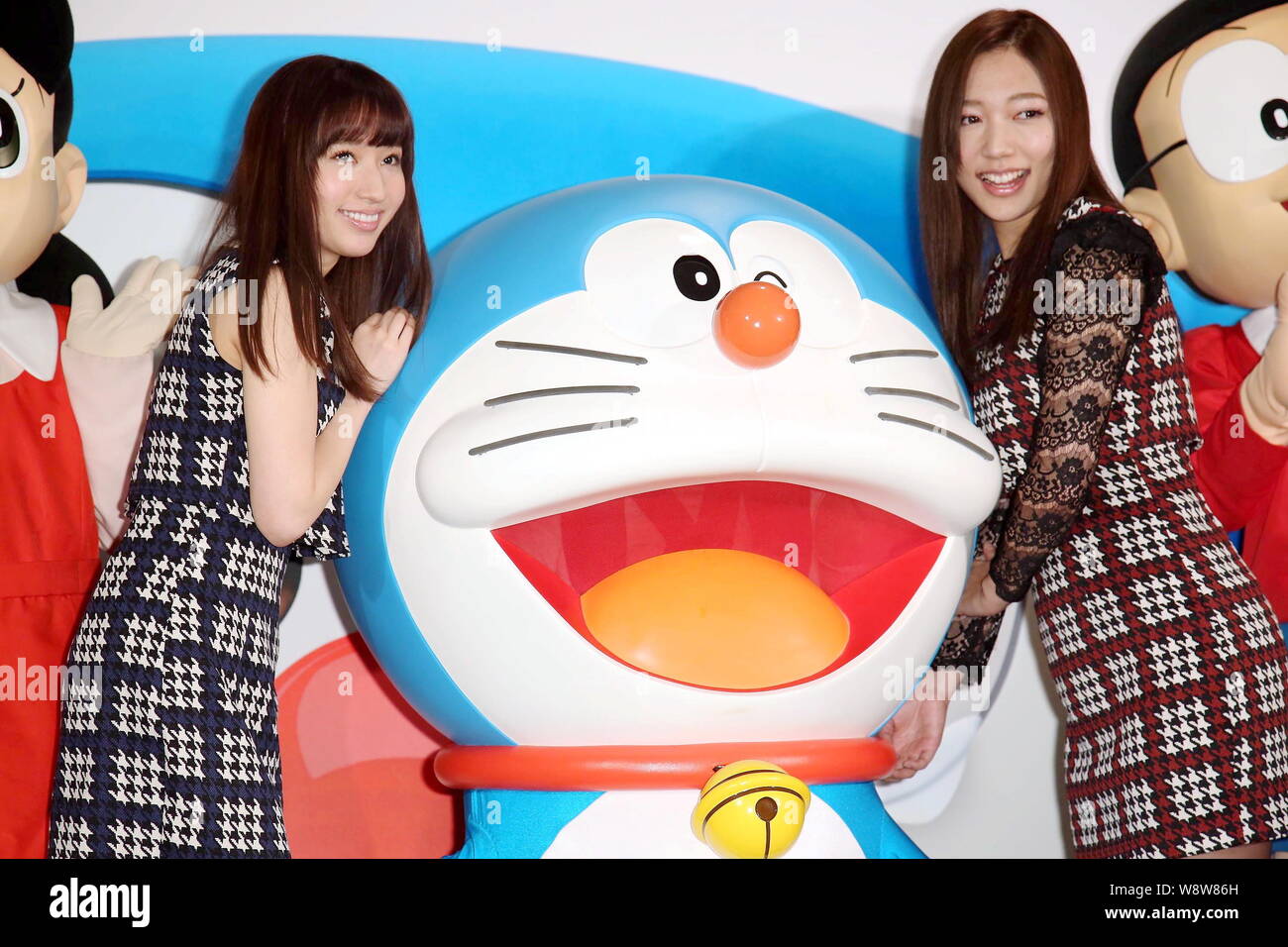 Japanese singers and actresses Haruka Katayama, left, and Misato Nonaka, both former members of ...