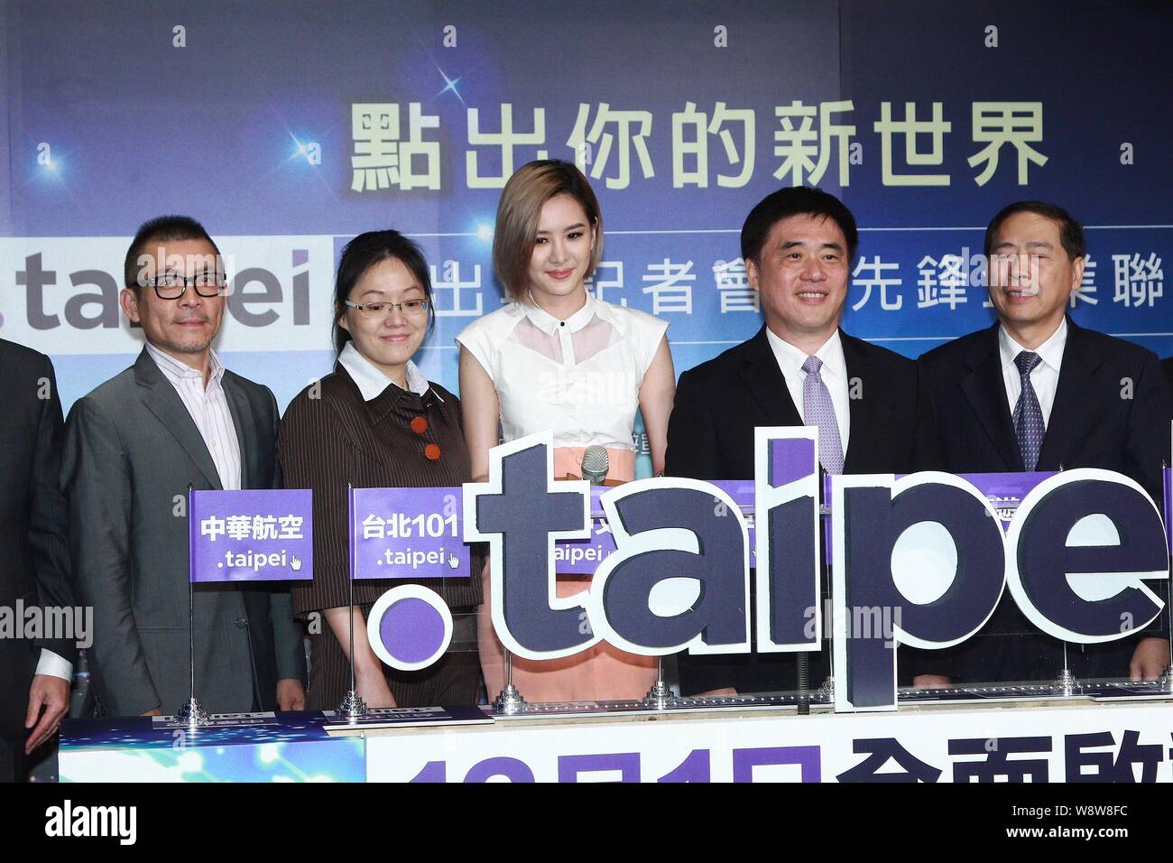 Taiwanese singer, actress and TV hostess Amber An, center, poses at a ...