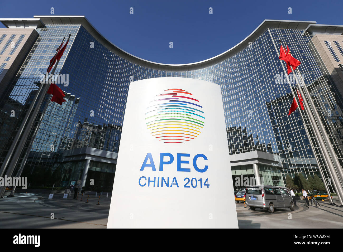 A signboard for APEC China 2014 is on display in front of the Oriental ...