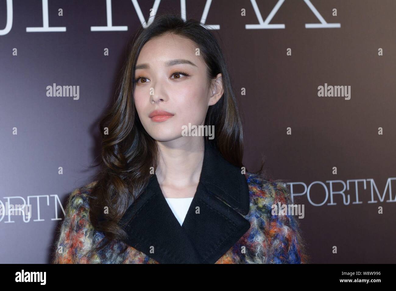 Chinese actress Ni Ni poses as she arrives for a fashion show of ...