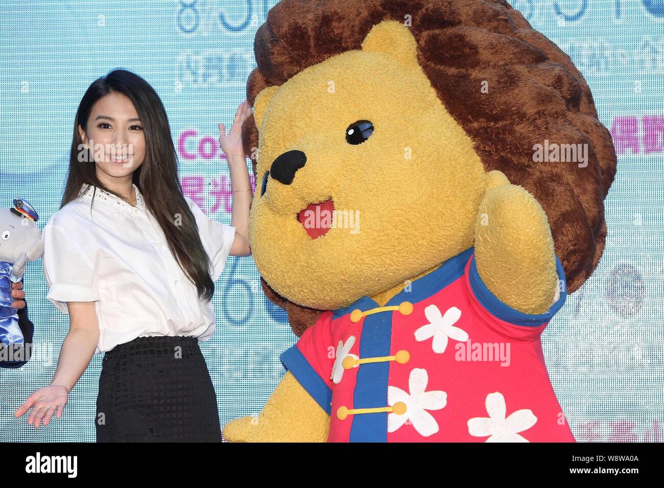 Hebe Tien of Taiwanese girl group S.H.E poses with a mascot during a ...