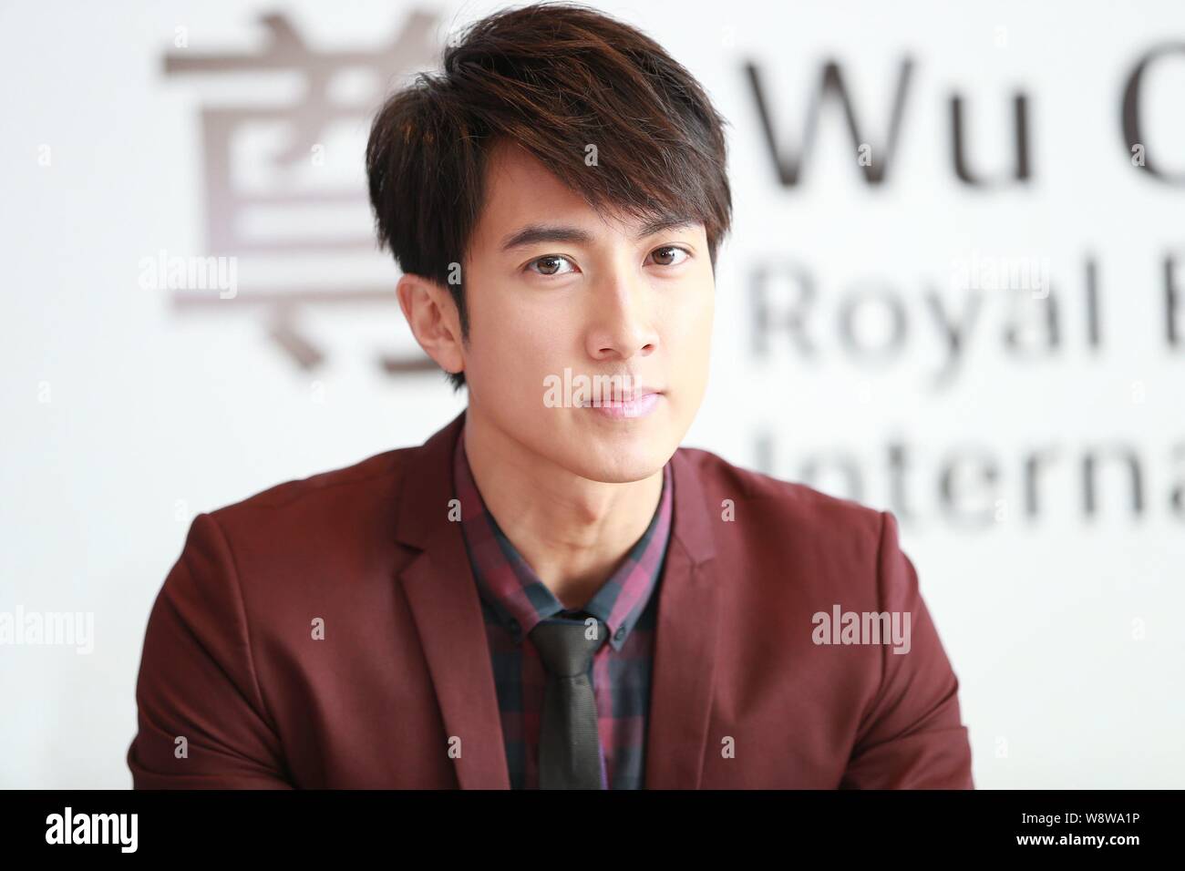 Bruneian actor Wu Chun poses during a signing ceremony for becoming the ...