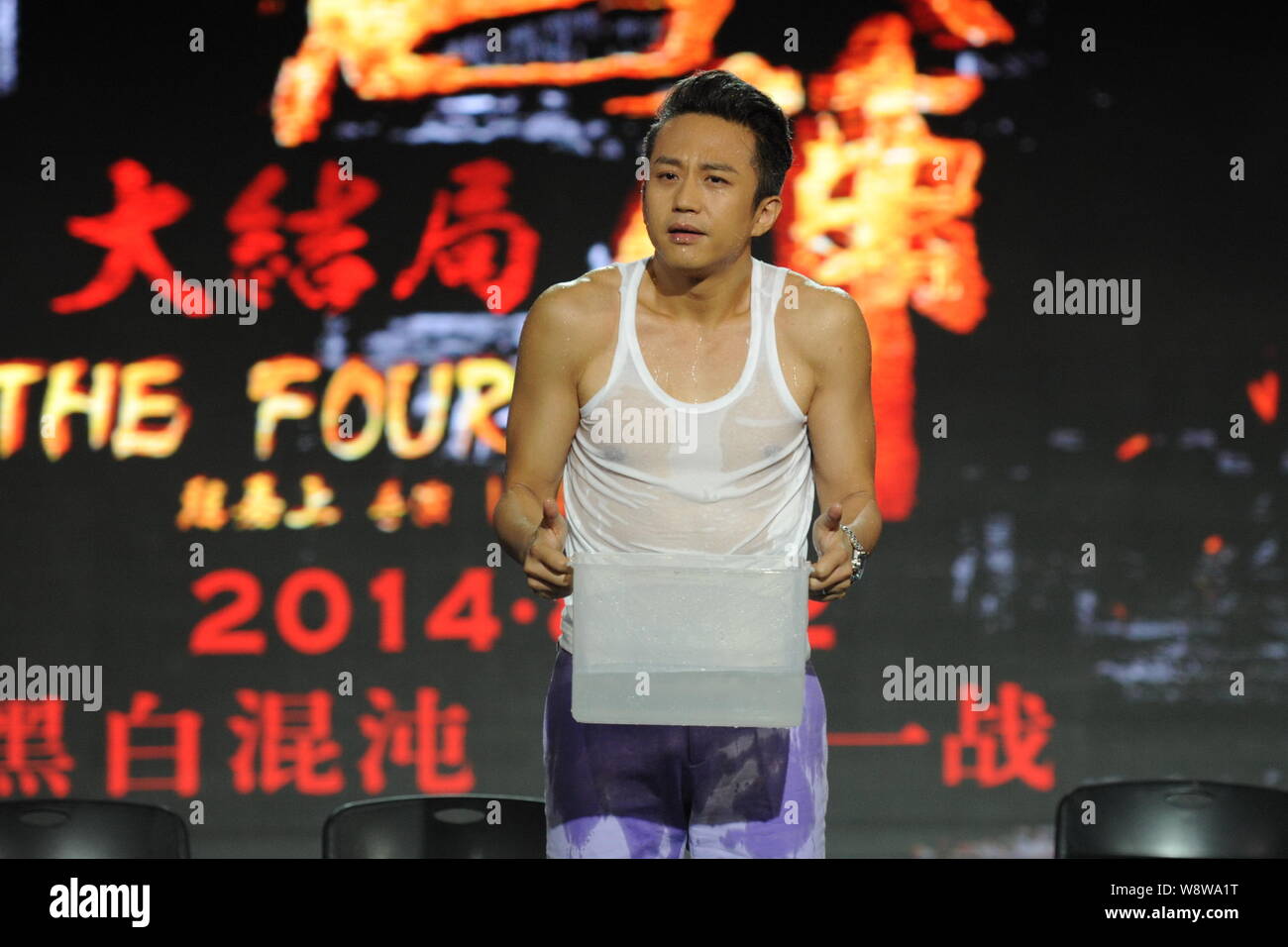 Chinese actor Deng Chao prepares for the Ice Bucket Challenge during a ...