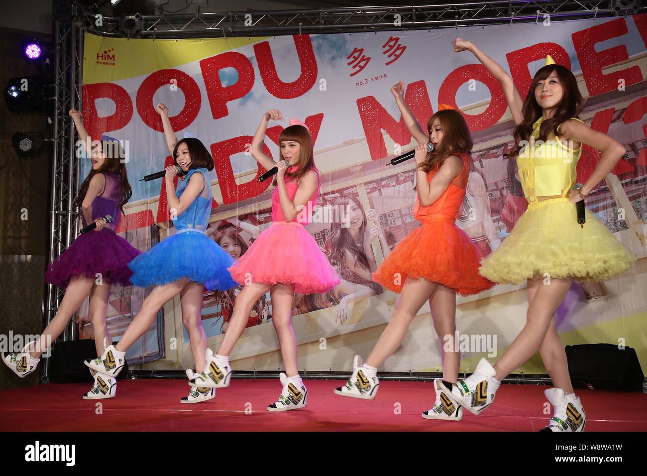 Members of Taiwanese pop gril group Popu Lady perform during a press ...