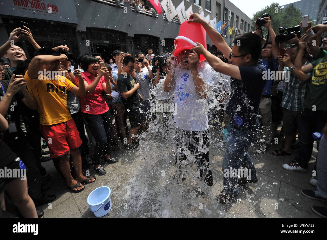 Chinese man water bucket hi-res stock photography and images - Alamy