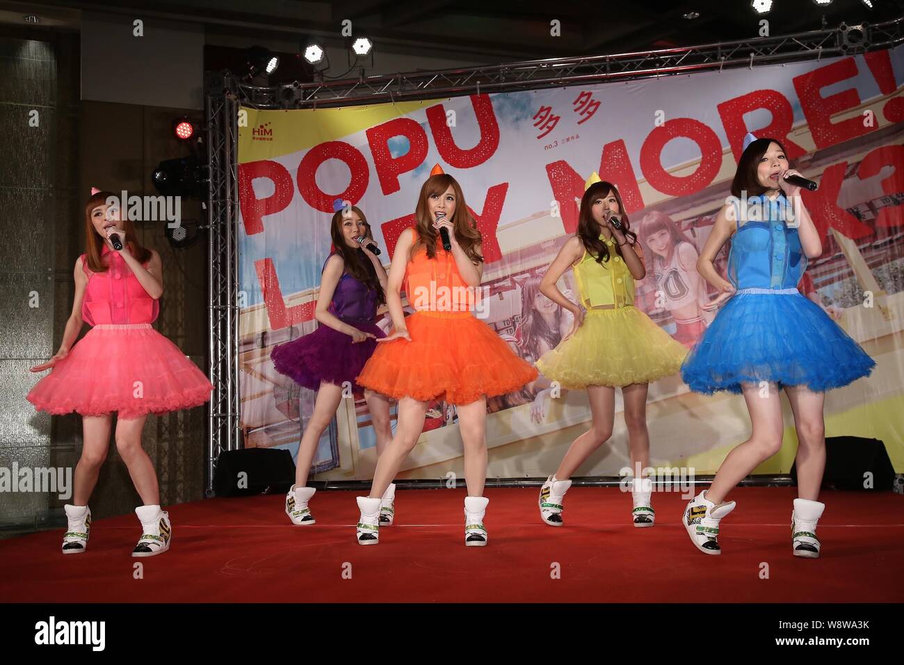 Members of Taiwanese pop gril group Popu Lady perform during a press ...