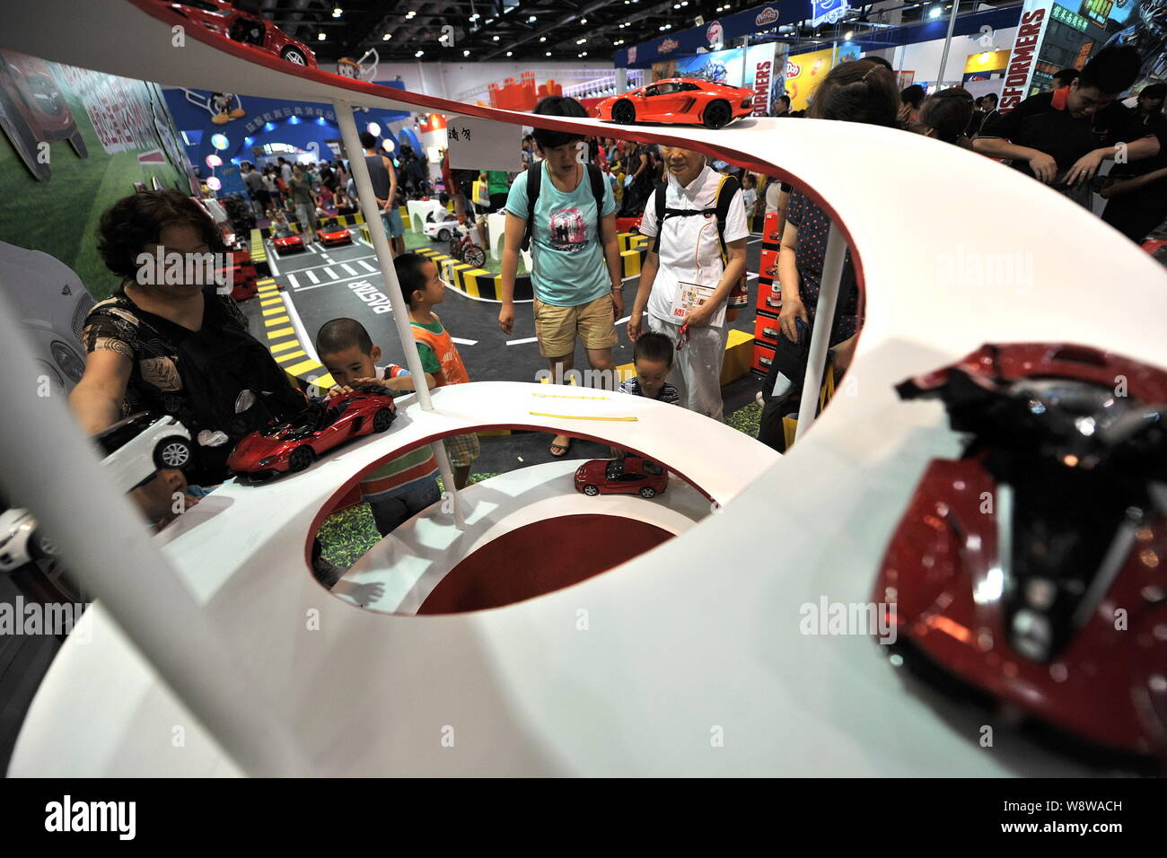 Children play with toy race cars during the 5th China (Beijing) Toy ...