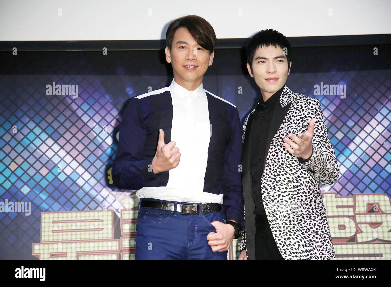 Taiwanese singers David Tao, left, and Jam Hsiao perform during a press ...