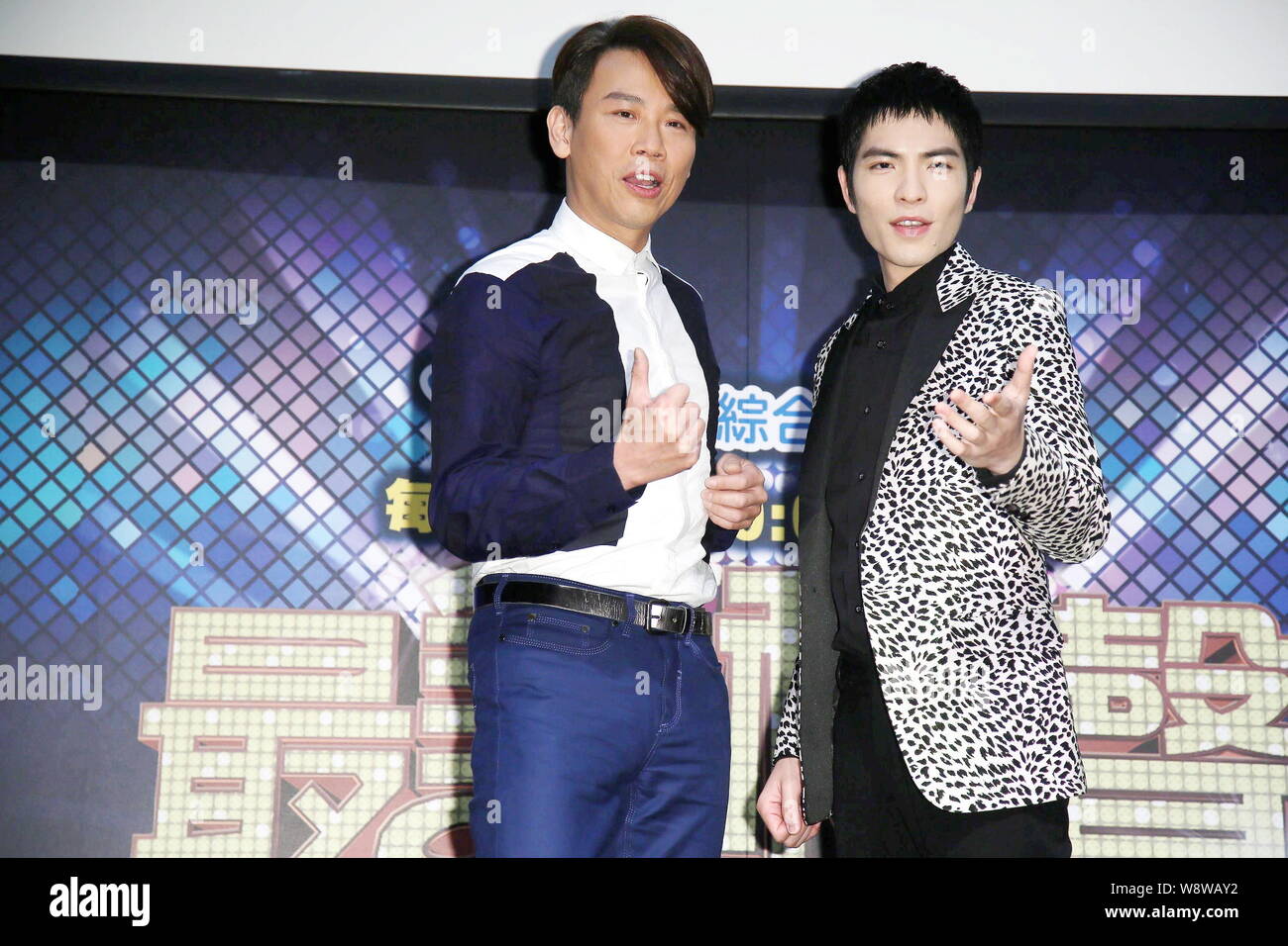 Taiwanese singers David Tao, left, and Jam Hsiao perform during a press ...