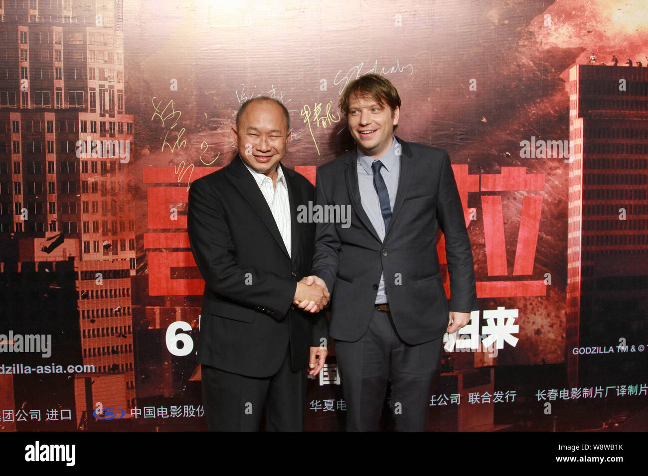 British director Gareth Edwards, right, shakes hands with Hong Kong ...