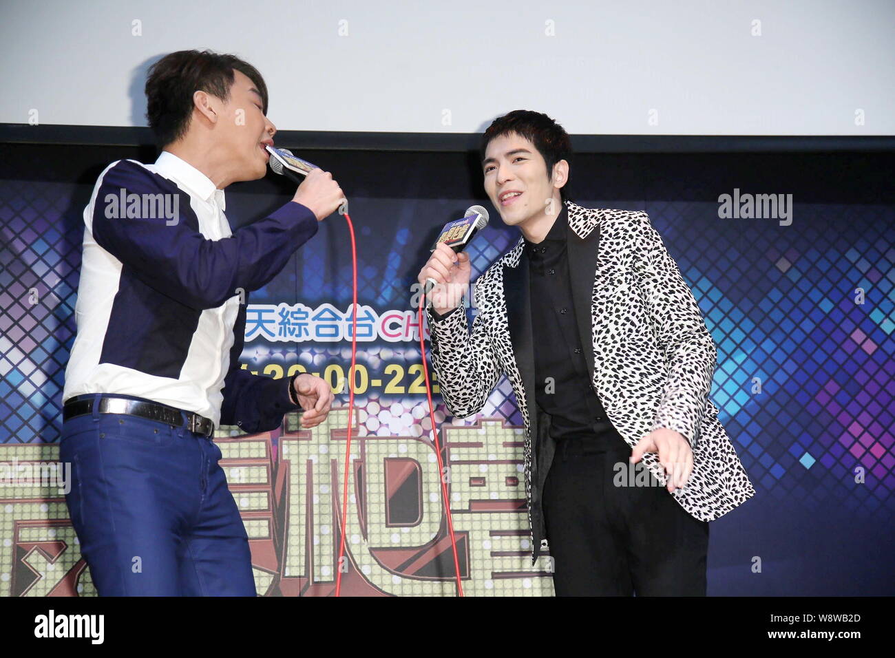 Taiwanese singers David Tao, left, and Jam Hsiao perform during a press ...