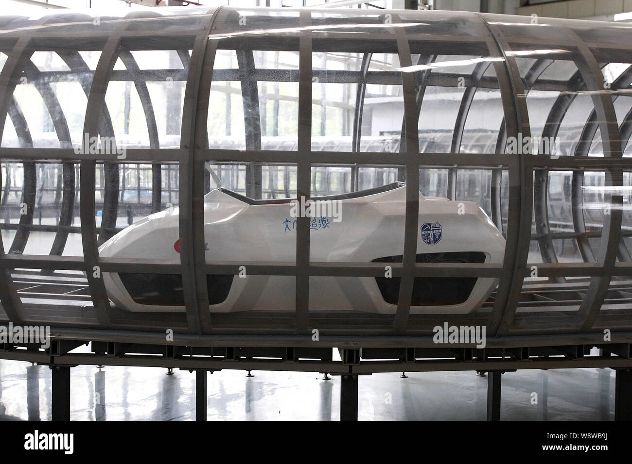 A super-maglev vehicle runs on a track during the trial run at ...