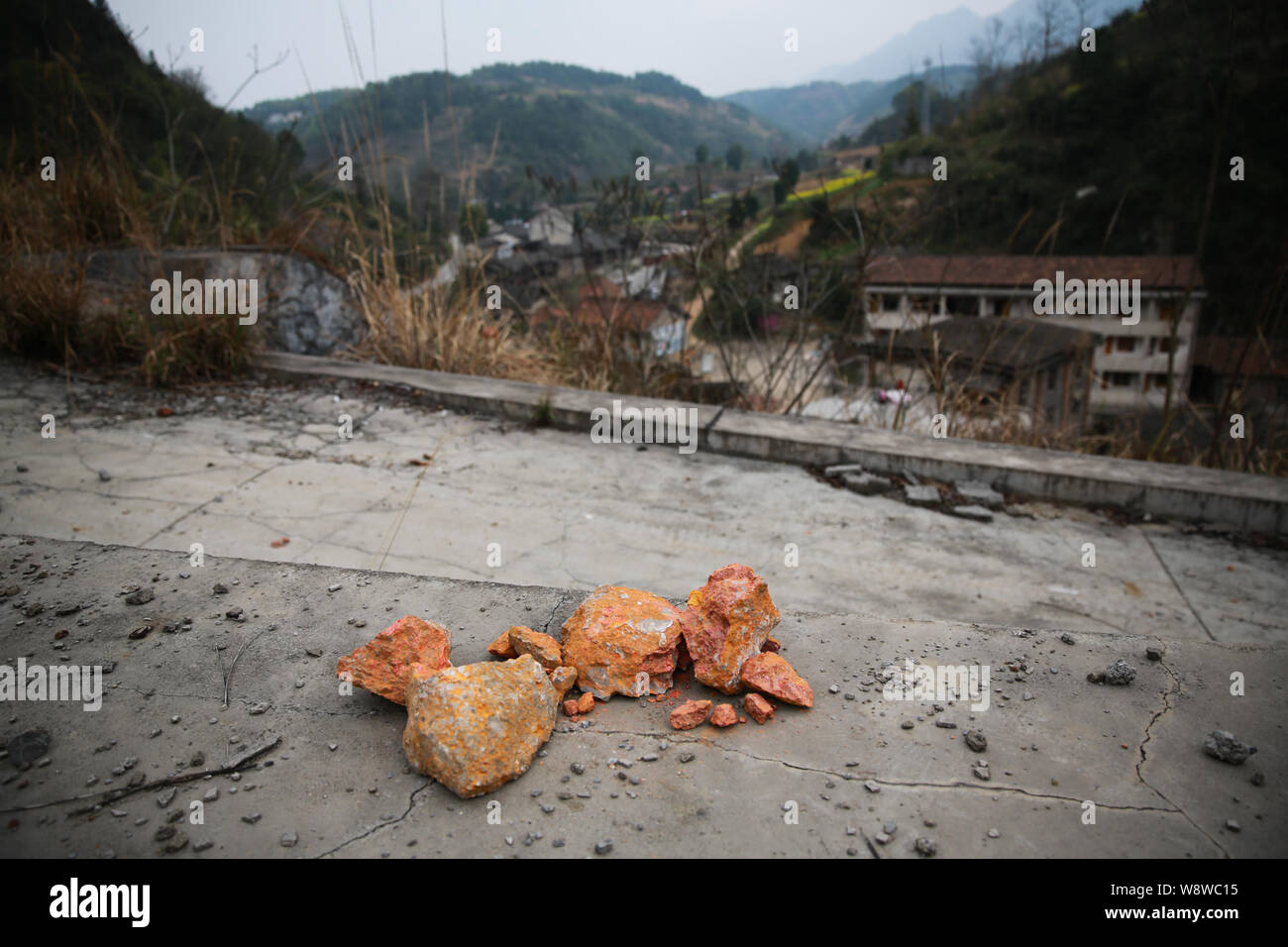 Realgar ores are pictured on a road in Heshan village, Shimen county ...