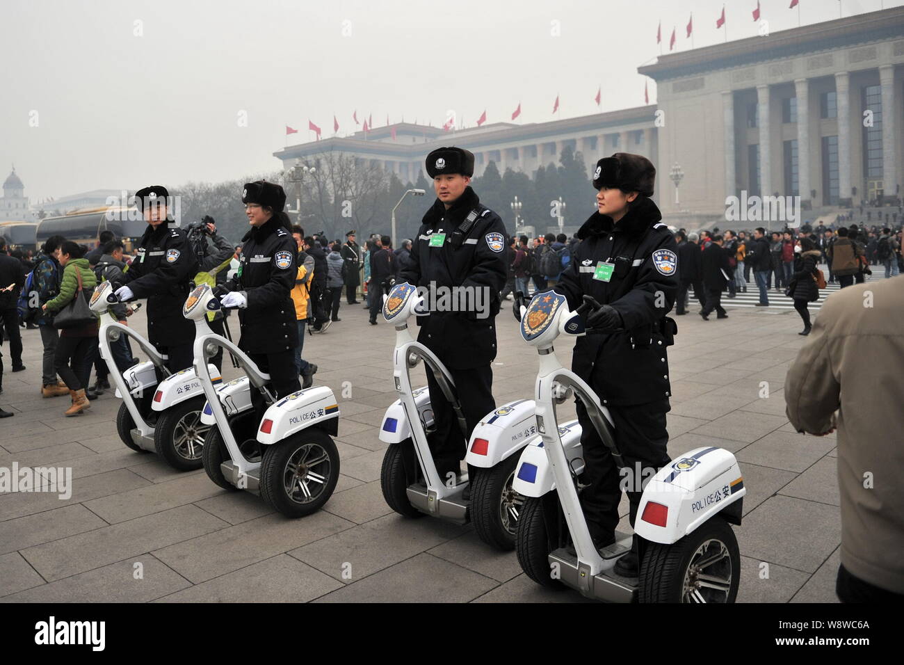 Chinese police officers ride Segway-like two-wheeled electric vehicles ...