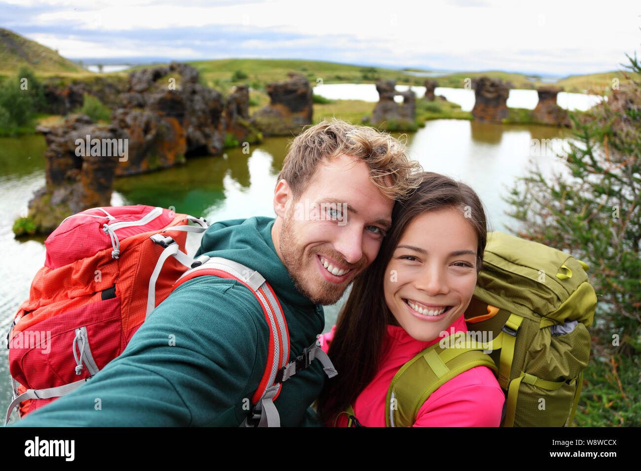 Selfie - travel couple on lake Myvatn Iceland. Friends taking selfies ...