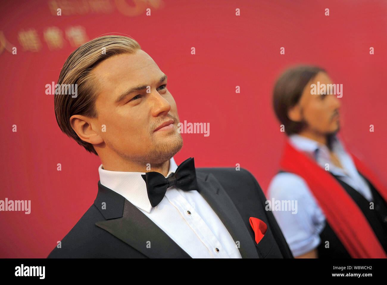 The wax statues of American actors Leonardo DiCaprio, front, and Johnny ...