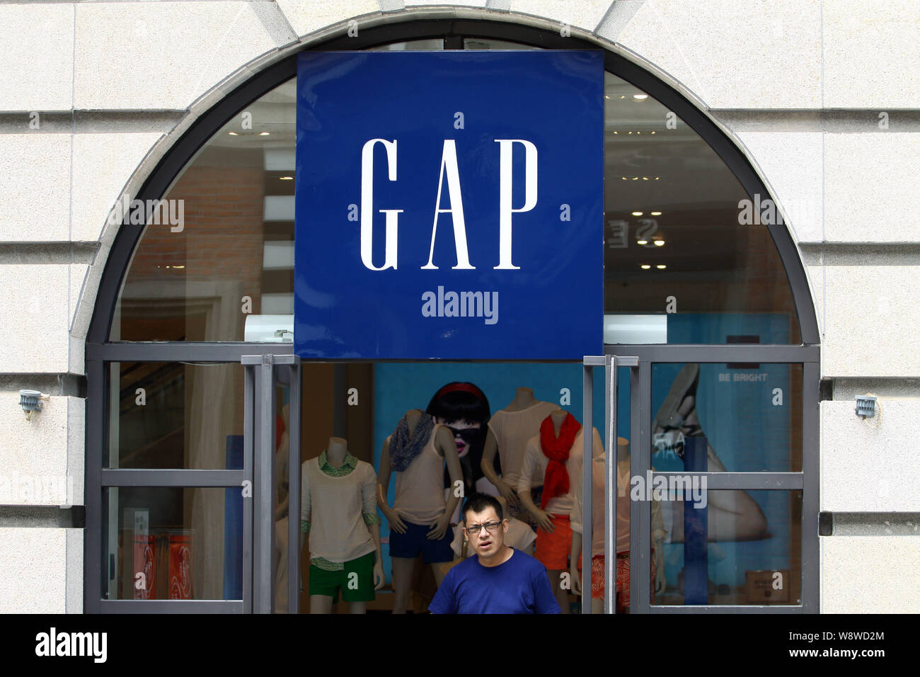 --FILE--A customer leaves a store of GAP in Wuhan city, central Chinas ...