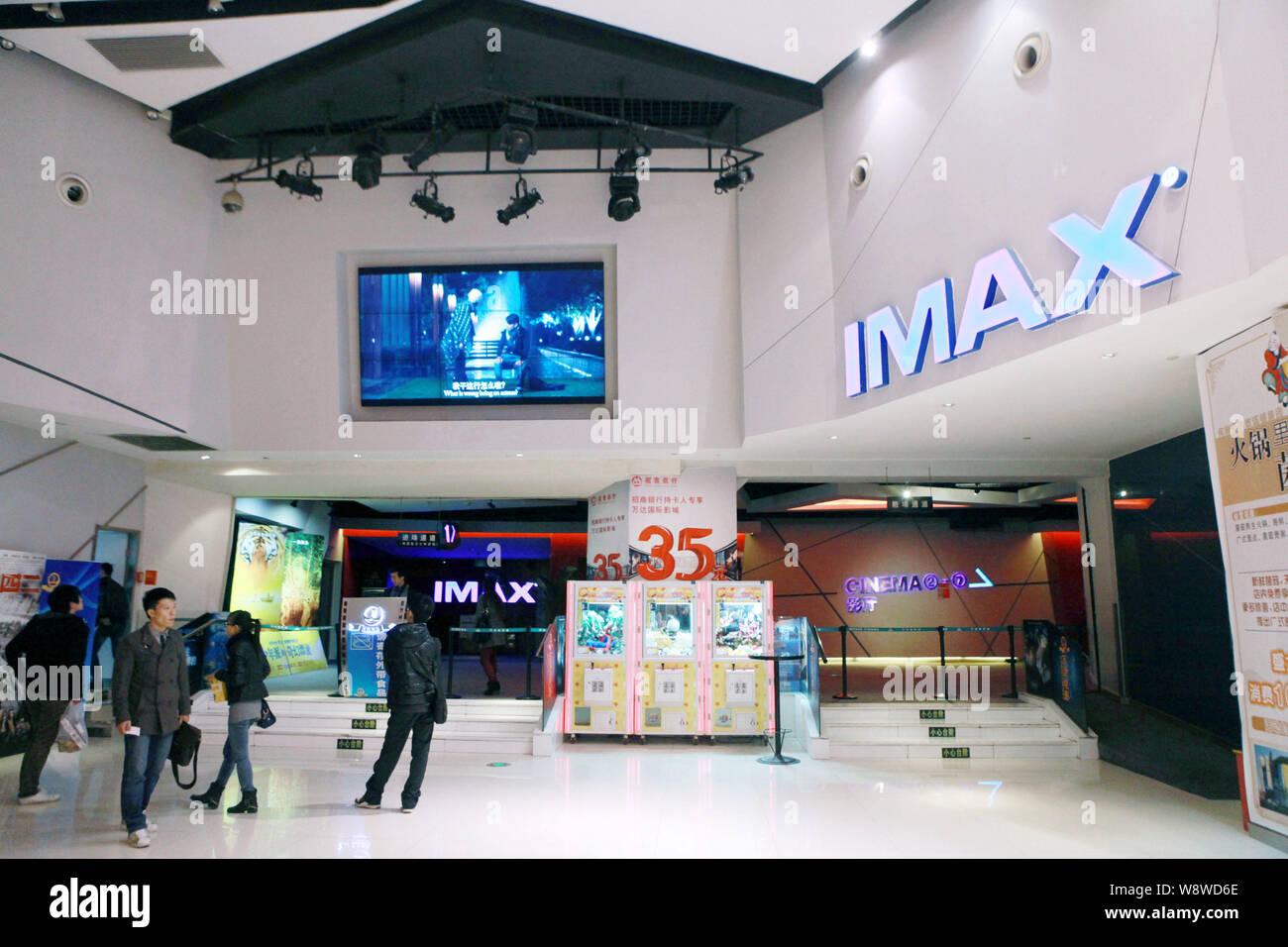 --FILE--Moviegoers are seen at a branch of Wanda cinema IMAX in ...