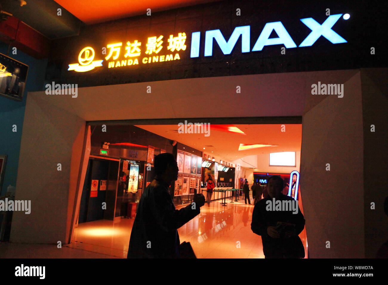 --FILE--Moviegoers are seen at a branch of Wanda cinema IMAX in ...
