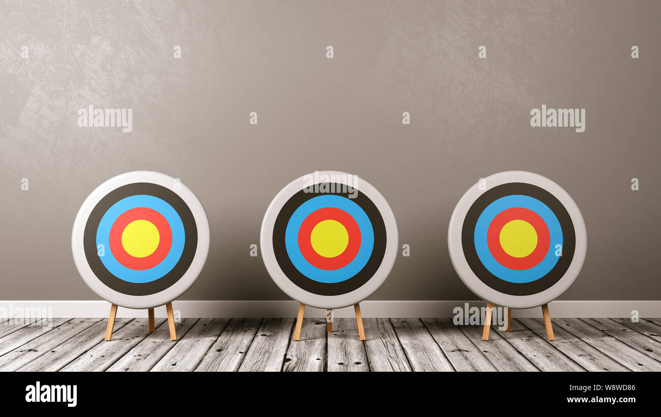 Three Colorful Arrow Targets on Wooden Floor in a Gray Wall Room with ...