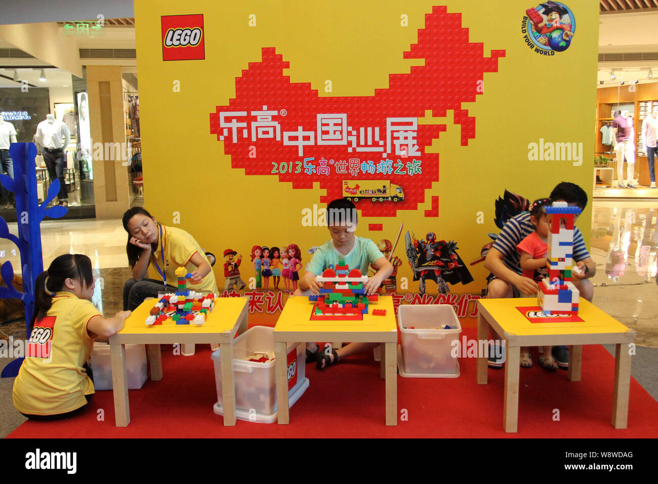 --FILE--Chinese children play with Lego bricks at Wuhan International ...