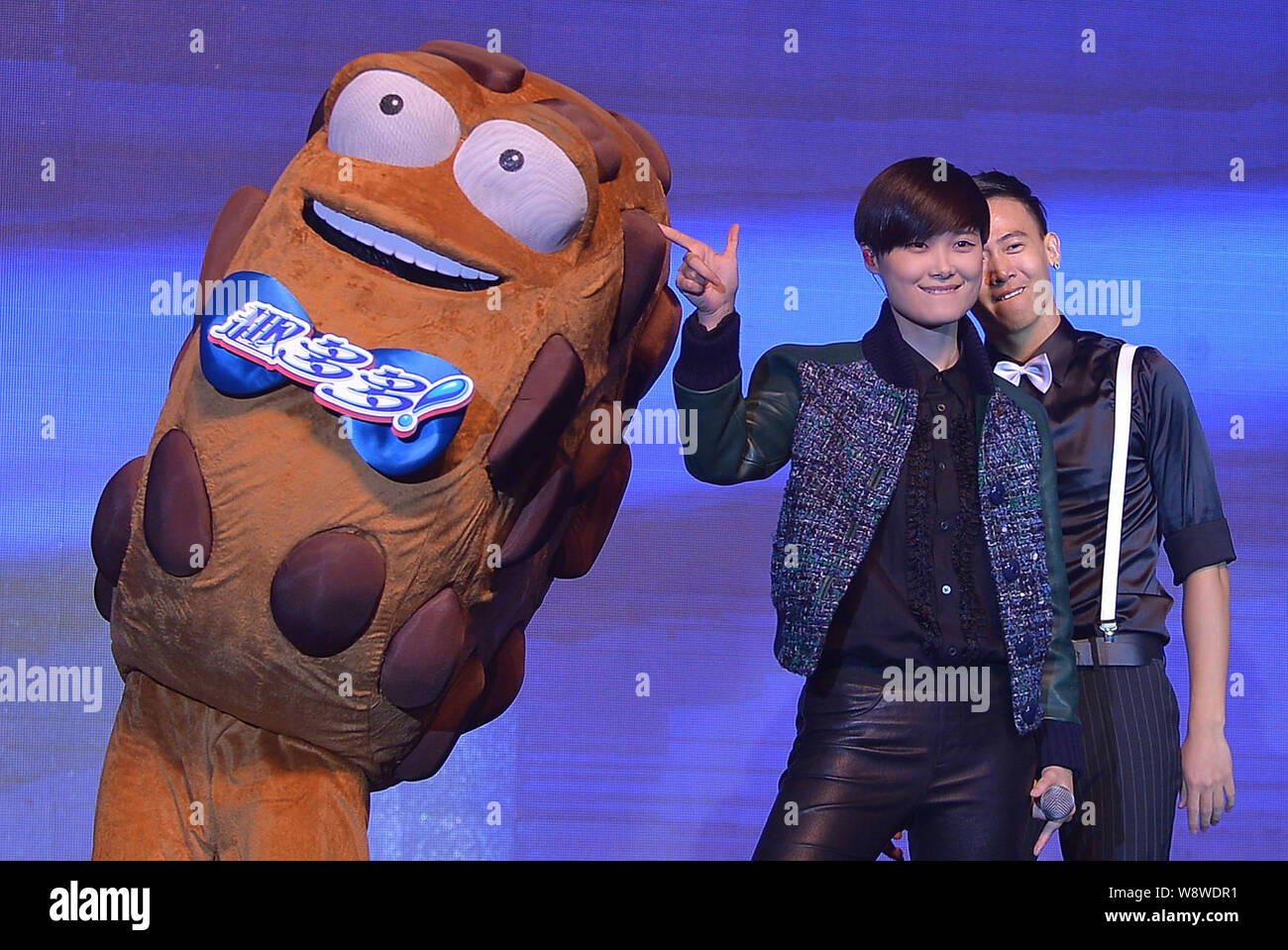 Chinese singer Li Yuchun, center, poses during a press conference for ...