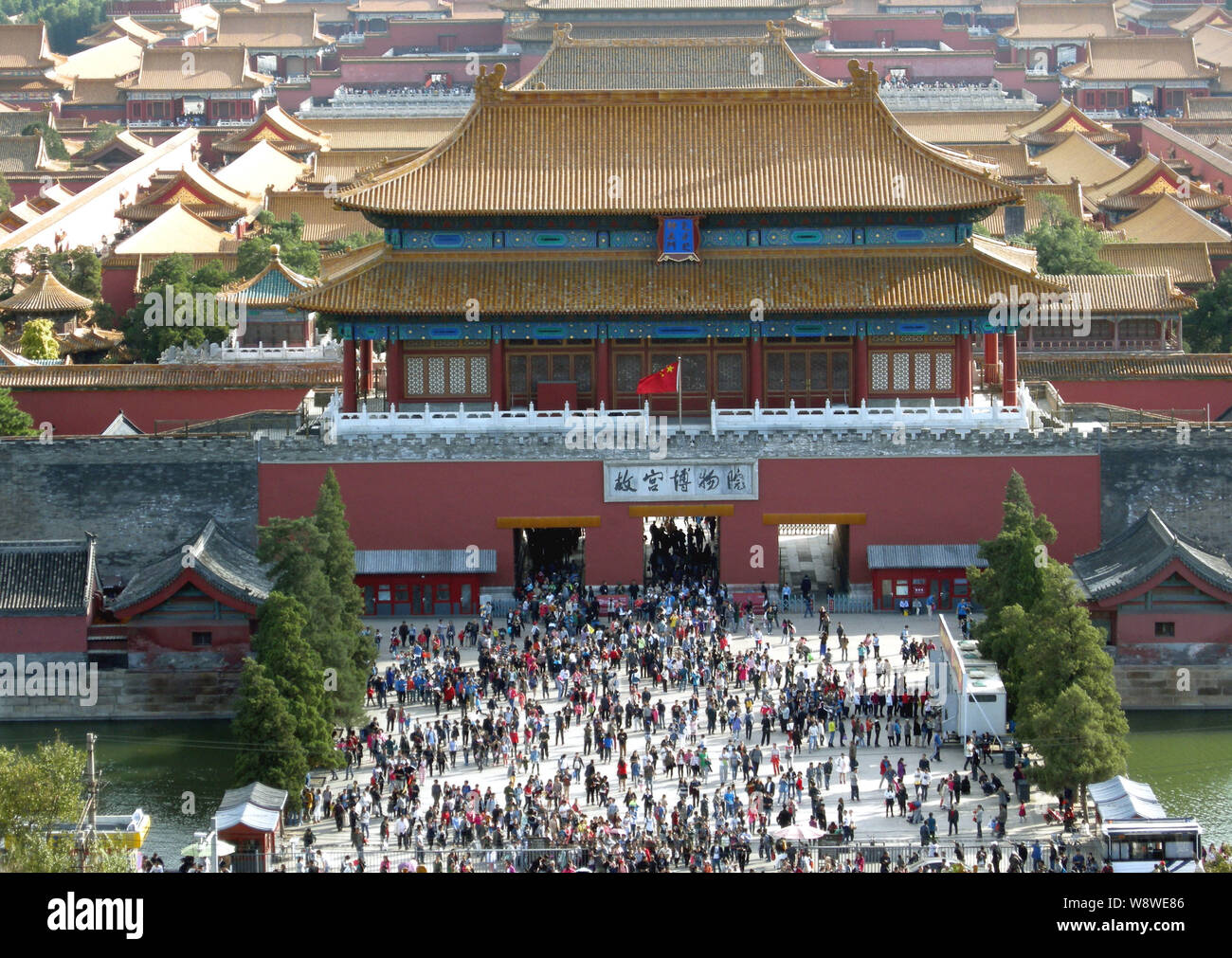Crowd of tourists are seen in front of the Palace Museum, also known as ...